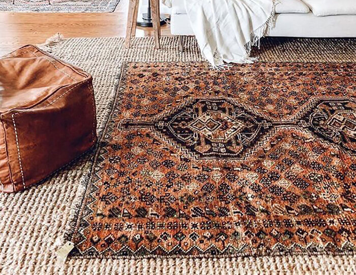 How to Lay an Area Rug Over Carpet